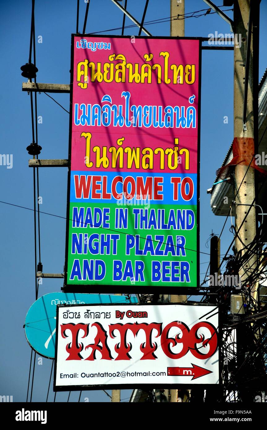 Pattaya, Thailand: Signs and electric wires hang from poles lining ...