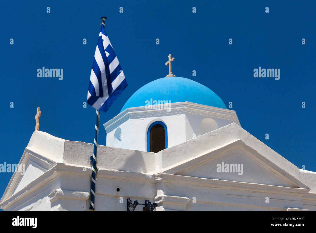 Church with Greek national flag at Chora, Mykonos Stock Photo - Alamy