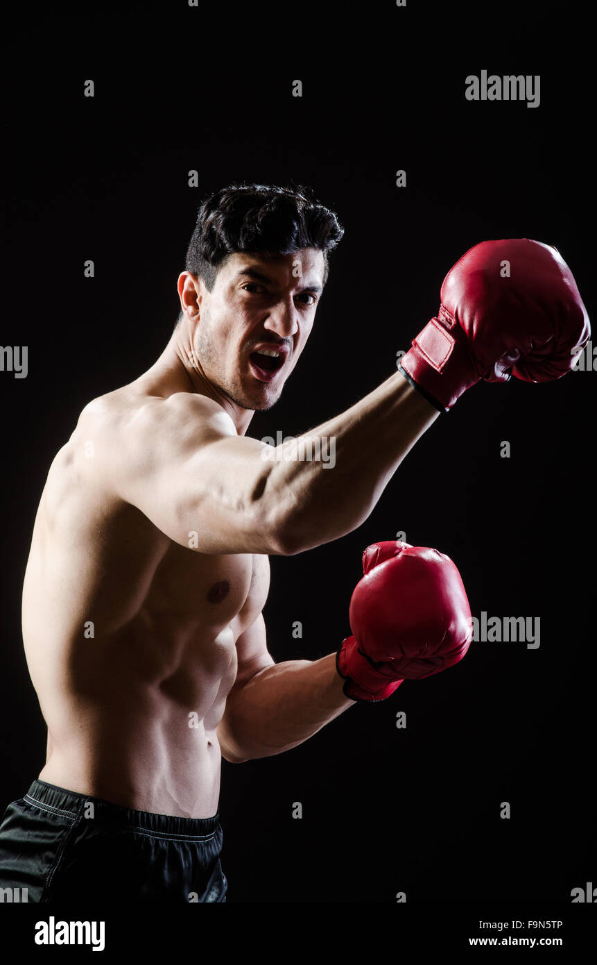 Muscular man in boxing concept Stock Photo - Alamy