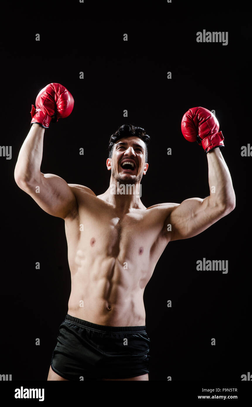 Muscular man in boxing concept Stock Photo - Alamy