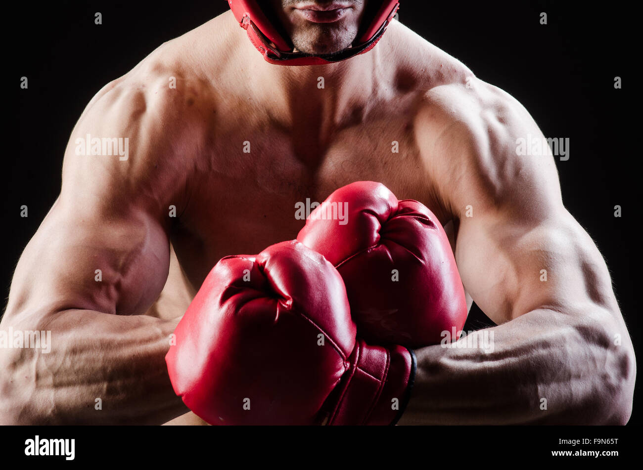 Muscular man in boxing concept Stock Photo - Alamy