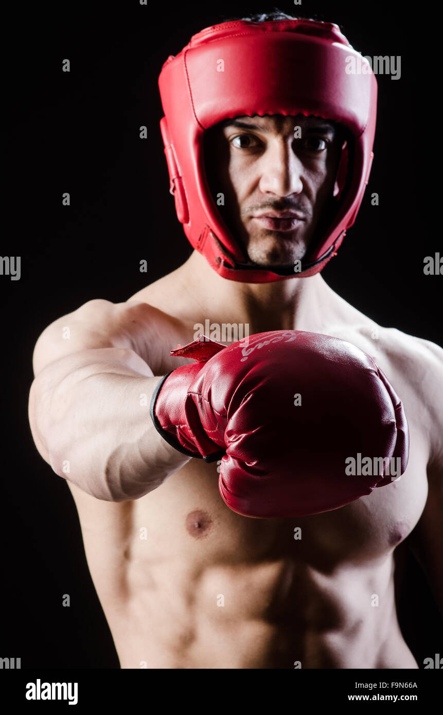 Muscular man in boxing concept Stock Photo - Alamy