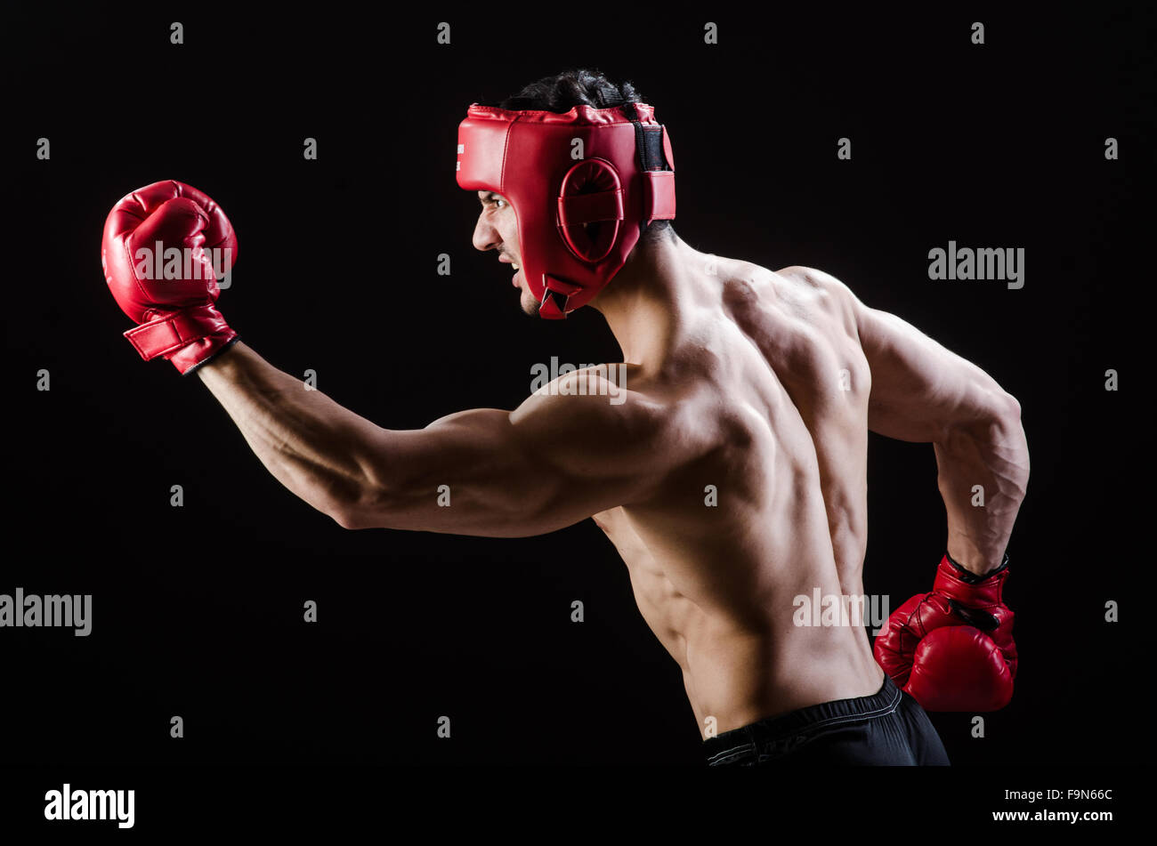 Muscular man in boxing concept Stock Photo - Alamy