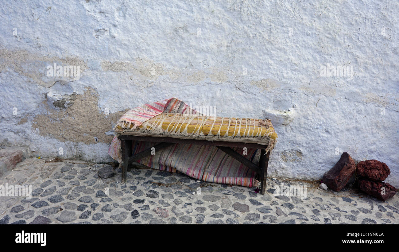 rotten bench in greece village Stock Photo - Alamy