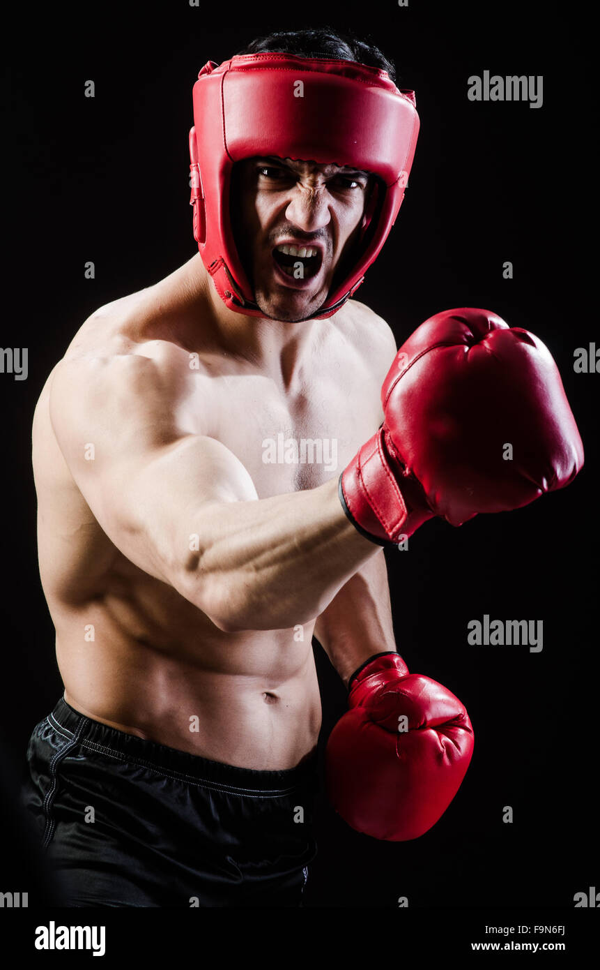 Muscular man in boxing concept Stock Photo - Alamy