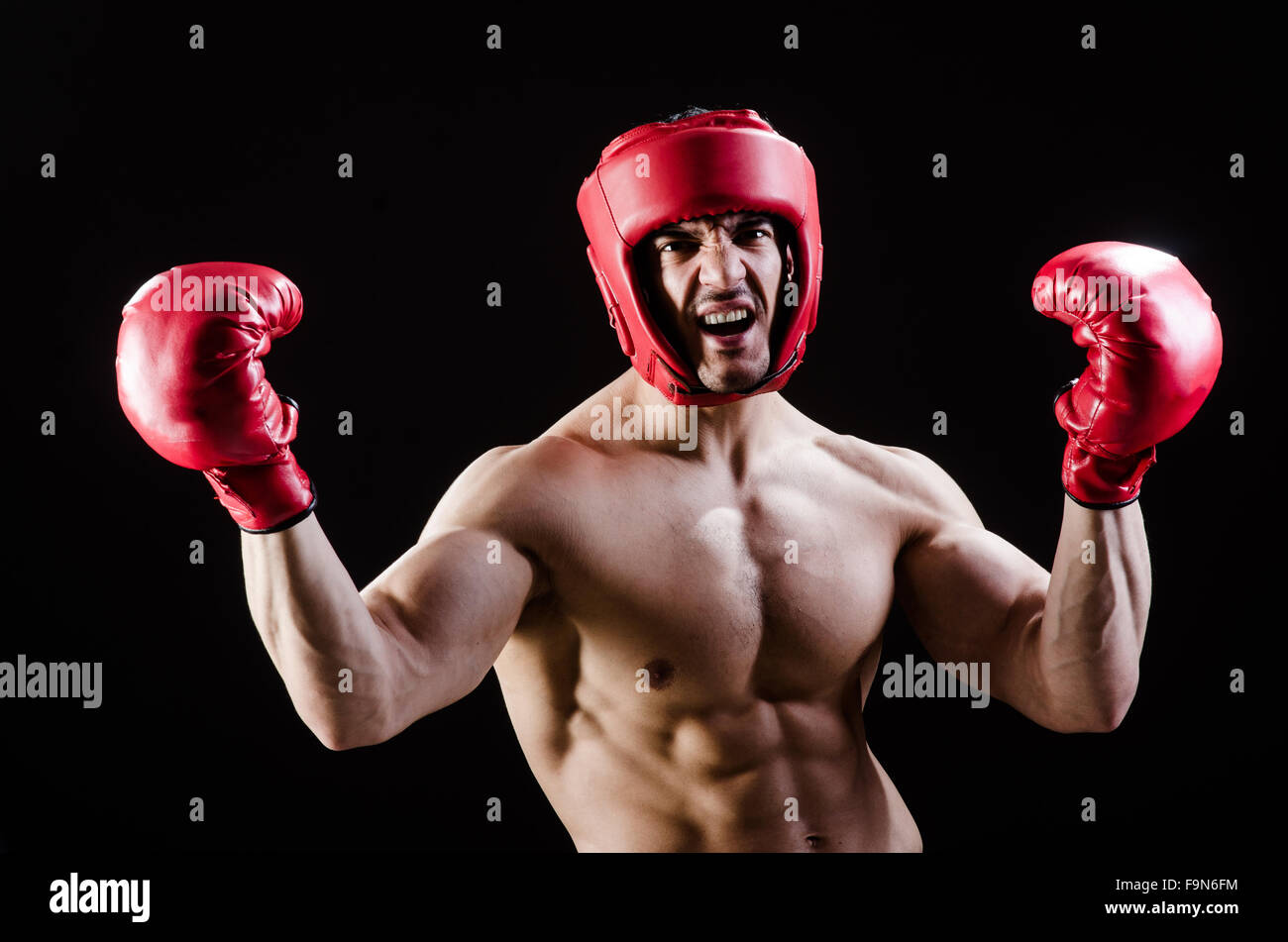 Muscular man in boxing concept Stock Photo - Alamy