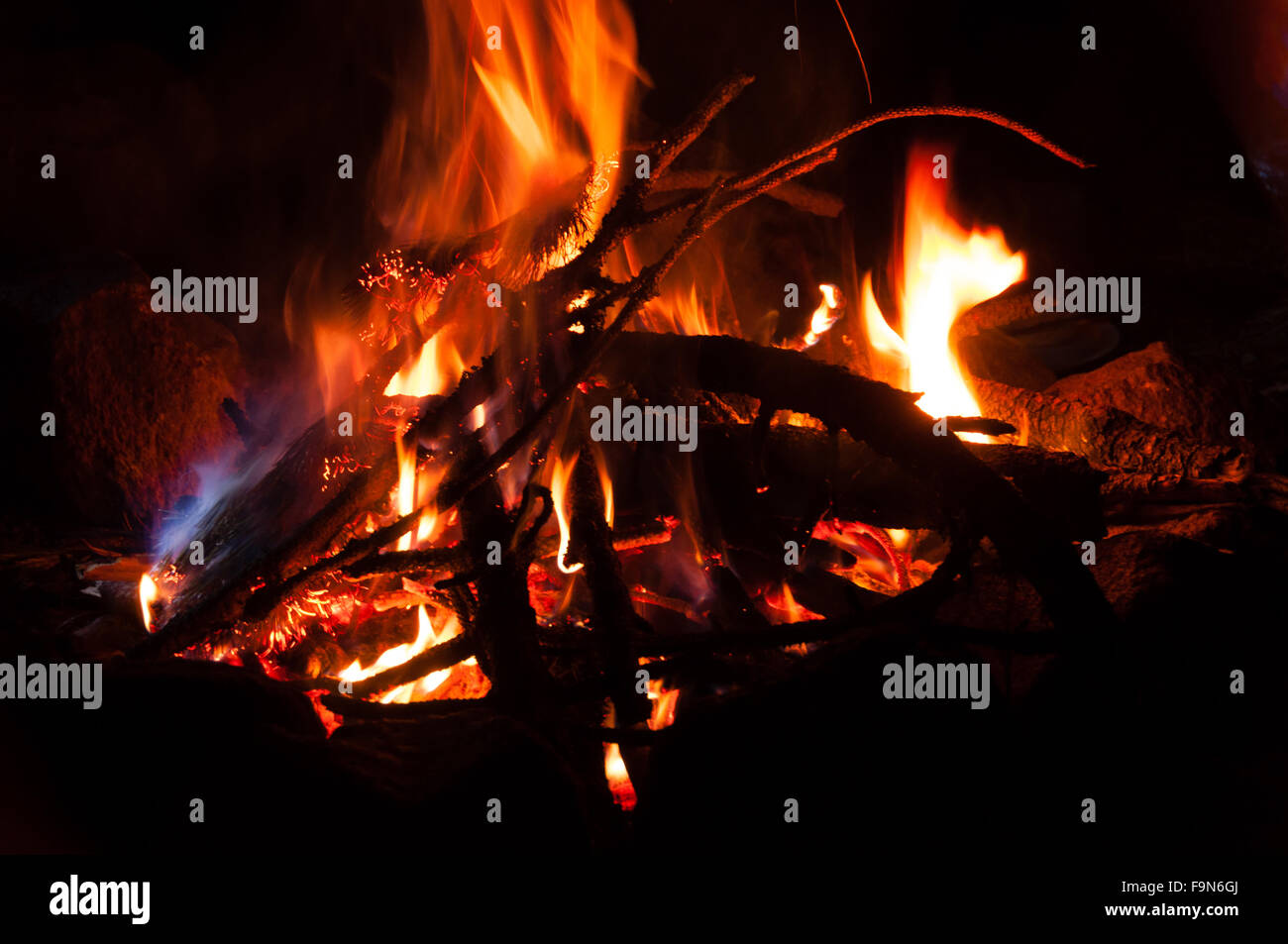 Campfire closeup at night with long exposure shot in the mountain ...