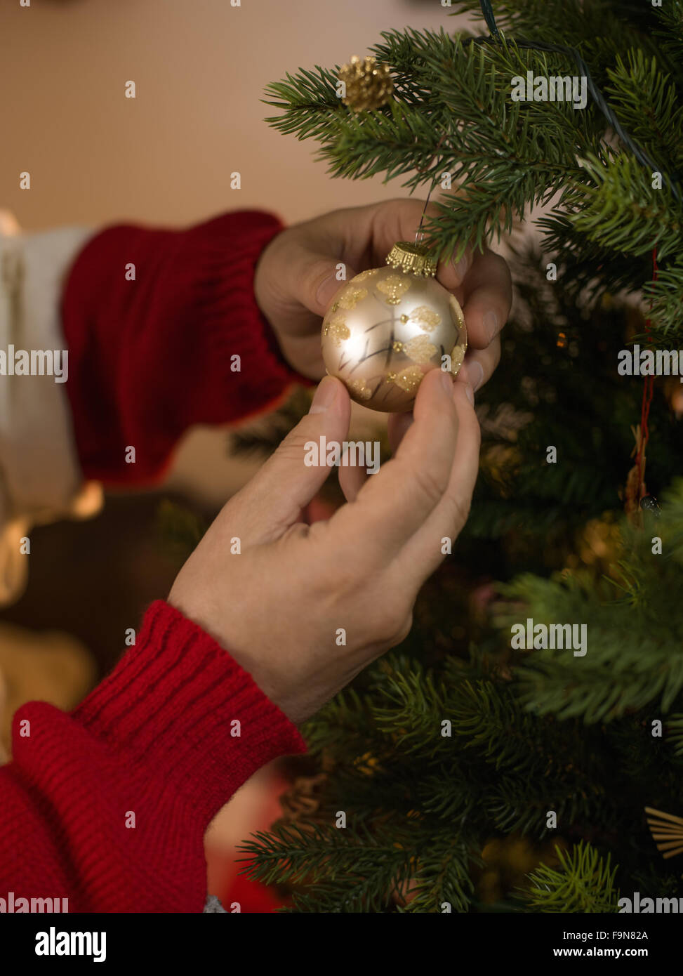 Santa Claus Decorating Christmas Tree at Home Stock Photo - Alamy