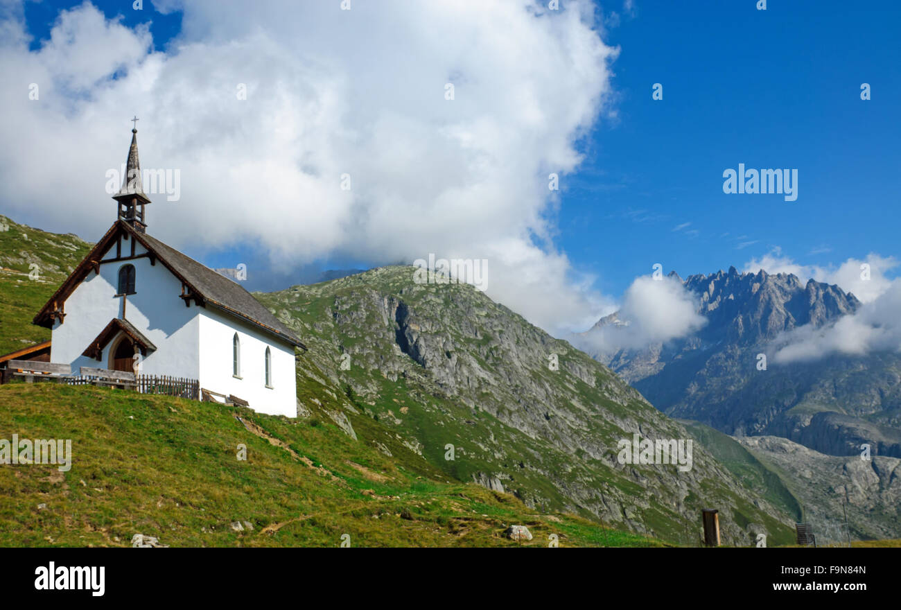 Landscape with a small white church in the swiss alps Stock Photo - Alamy