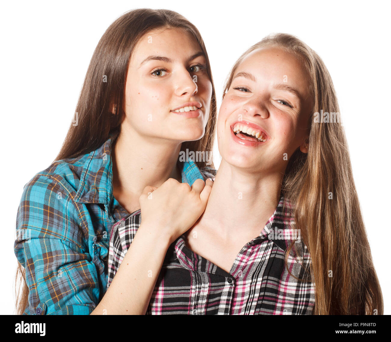 two cute teenagers having fun together isolated on white Stock Photo ...
