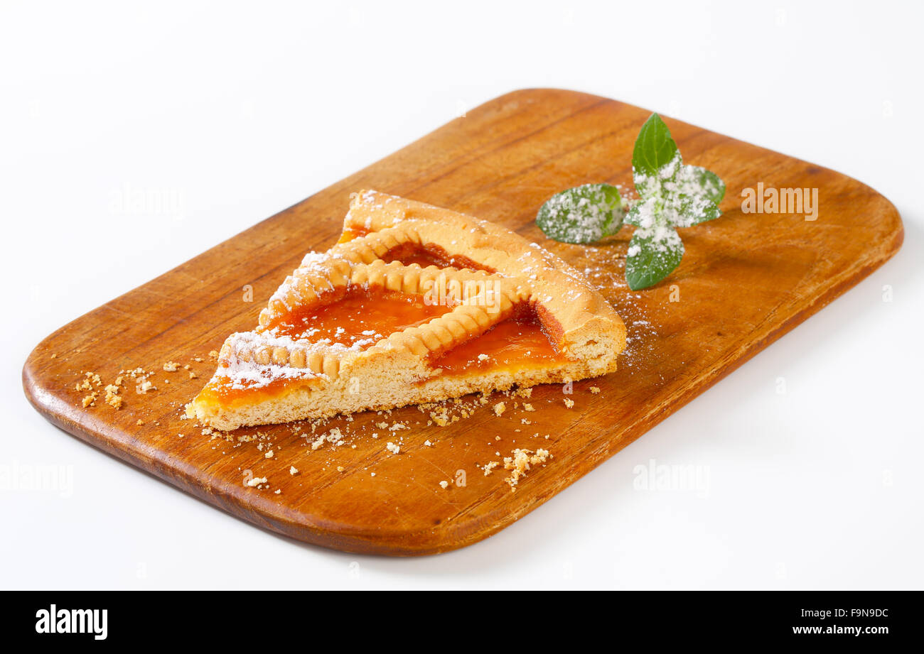 Slice of Linzer apricot tart Stock Photo - Alamy