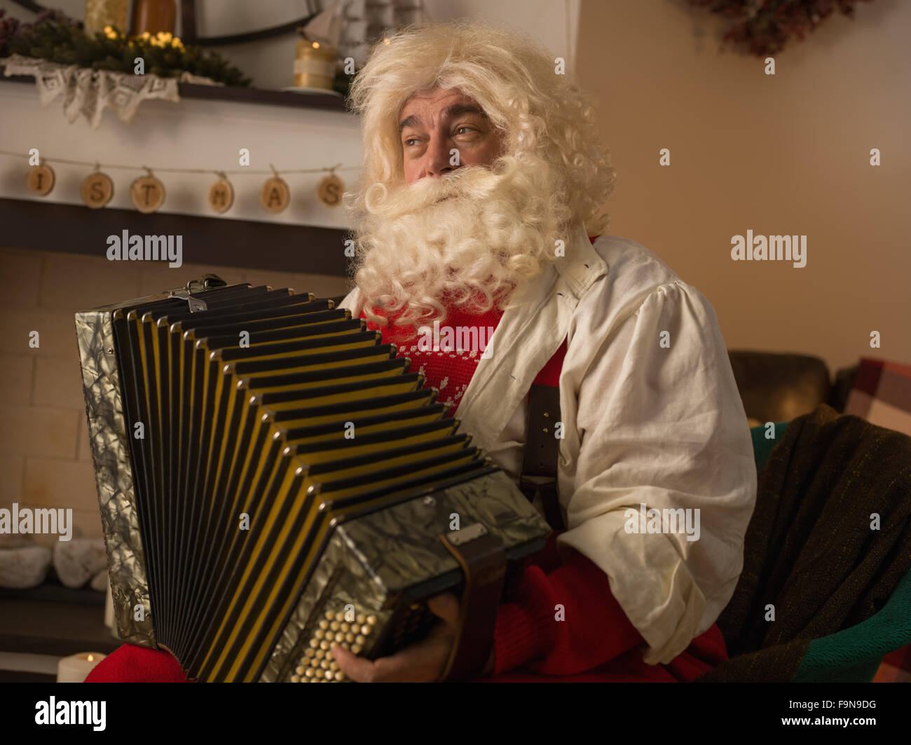 Santa Claus Playing Accordion at Home Stock Photo - Alamy