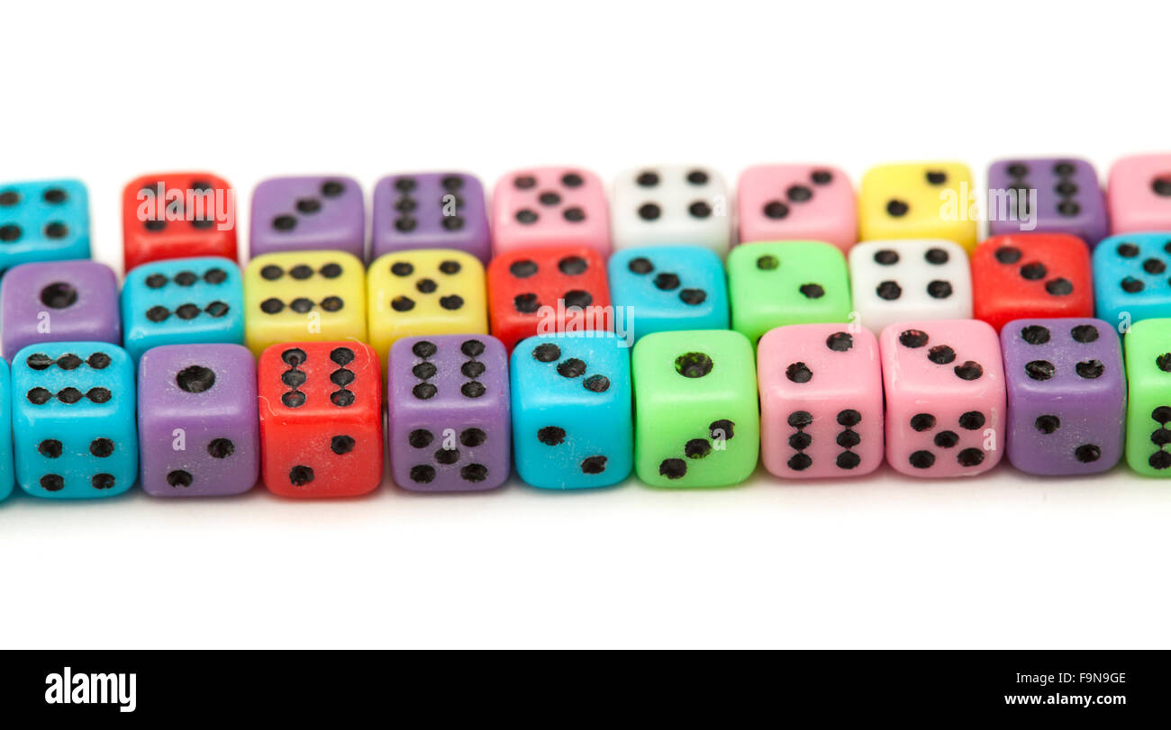 many small colorful plastic dice isolated on white background Stock ...