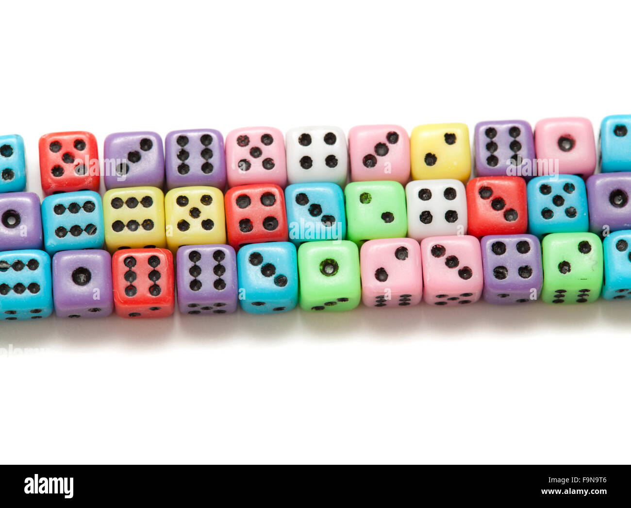 many small colorful plastic dice isolated on white background Stock ...