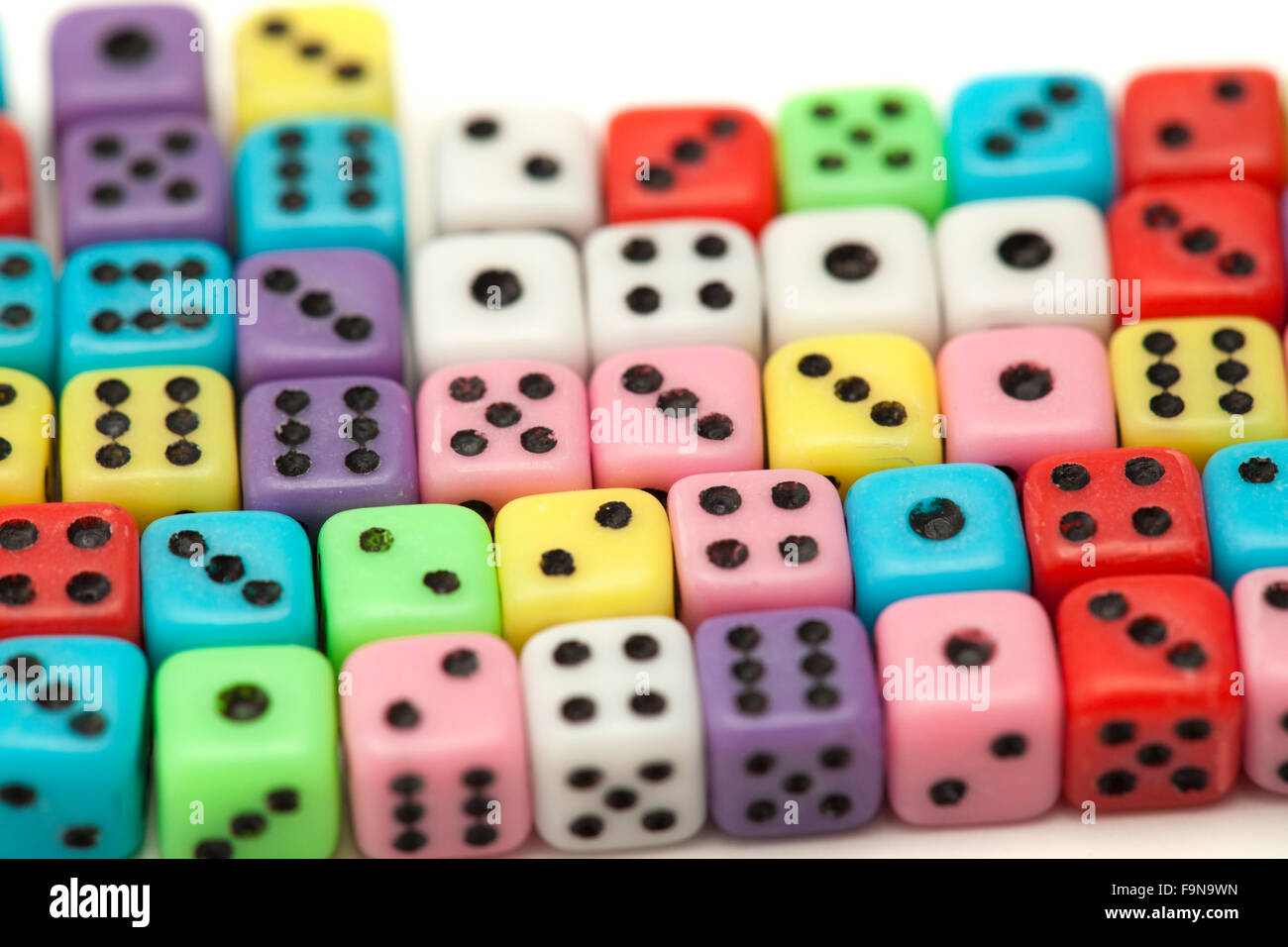 many small colorful plastic dice isolated on white background Stock ...