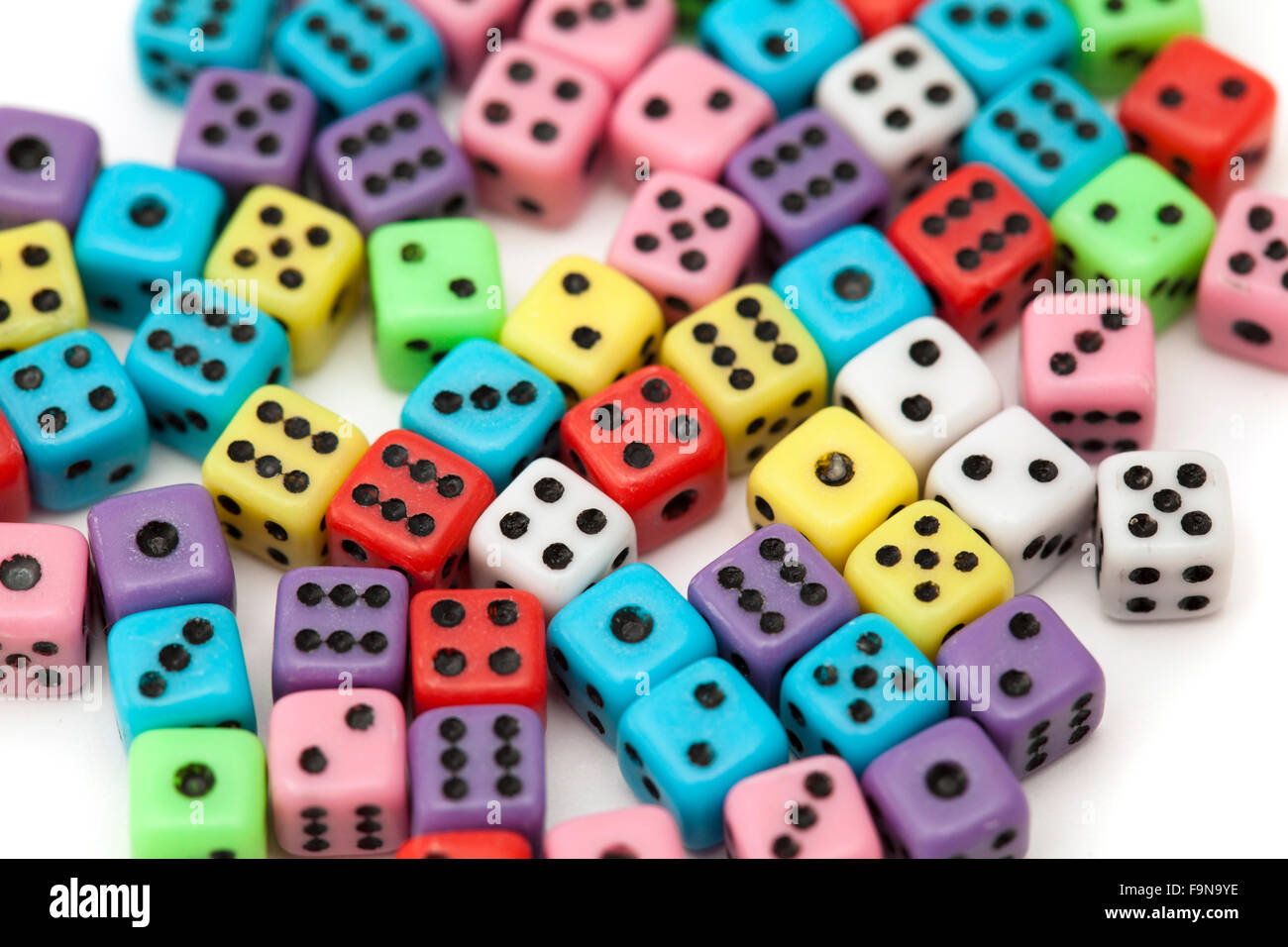 many small colorful plastic dice isolated on white background Stock ...