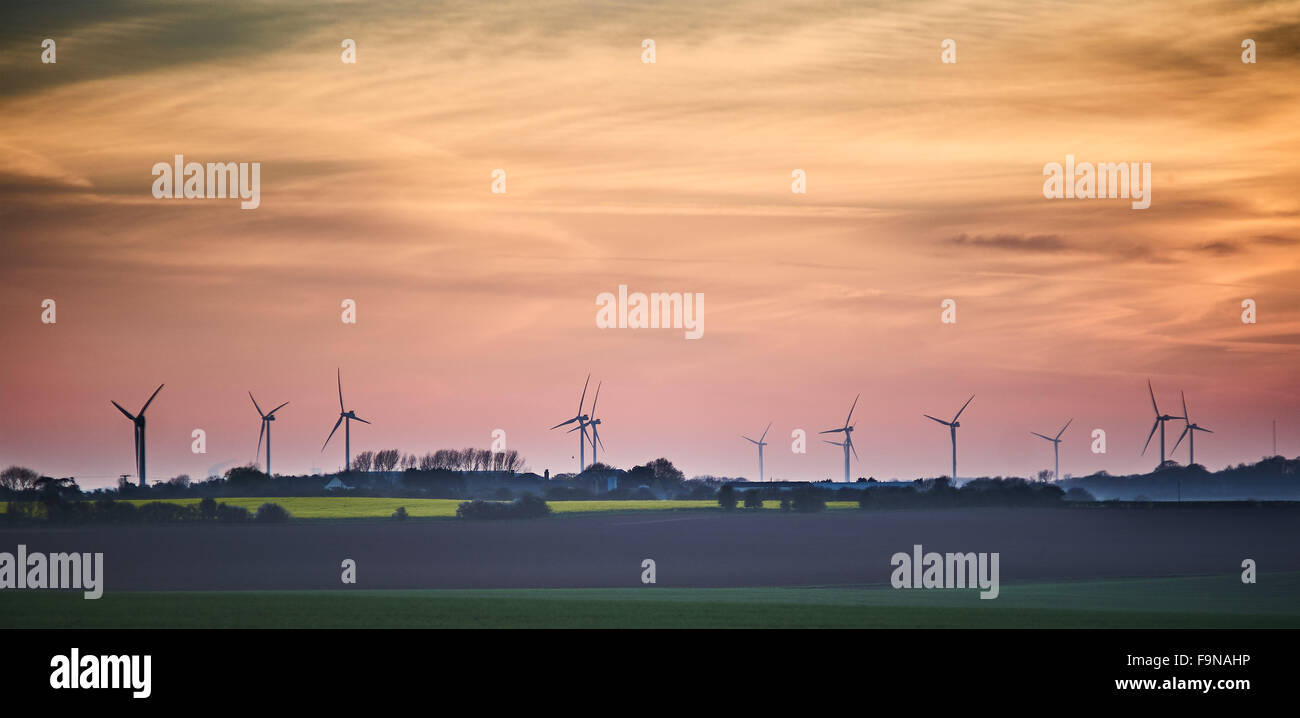 Wind turbines at a wind farm on farm land in Yorkshire during a summer ...