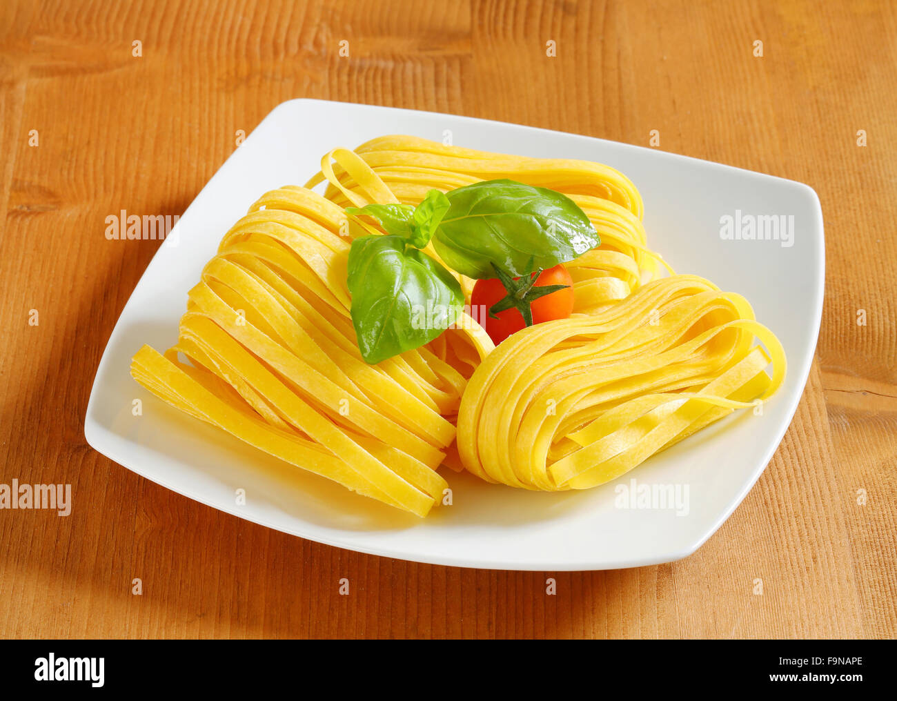 Thin ribbon pasta on plate Stock Photo - Alamy