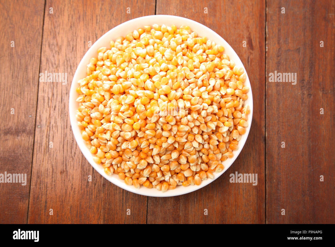 yellow corn grits in the white plate Stock Photo - Alamy