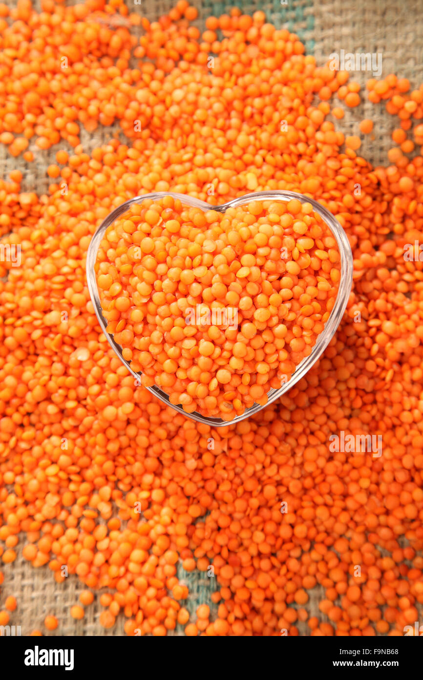 red rentils in a heart shaped container Stock Photo - Alamy