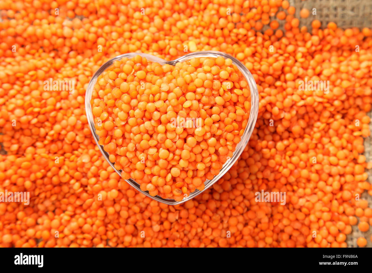 red rentils in a heart shaped container Stock Photo - Alamy