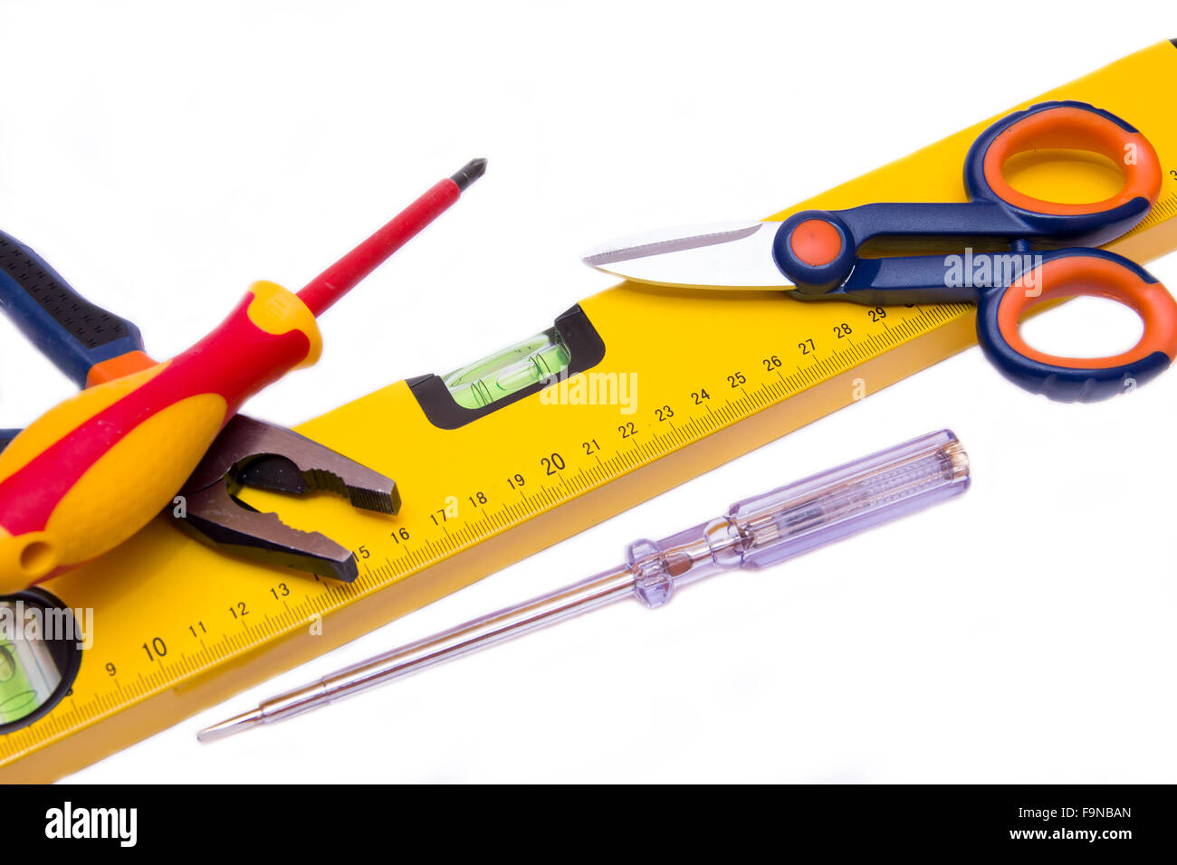 Working tools scattered on a white background Stock Photo - Alamy