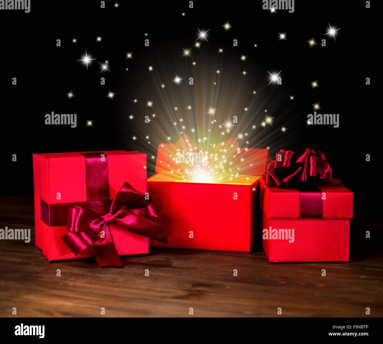 gift box and bow is opened with fairy tale miracle is isolated on black ...