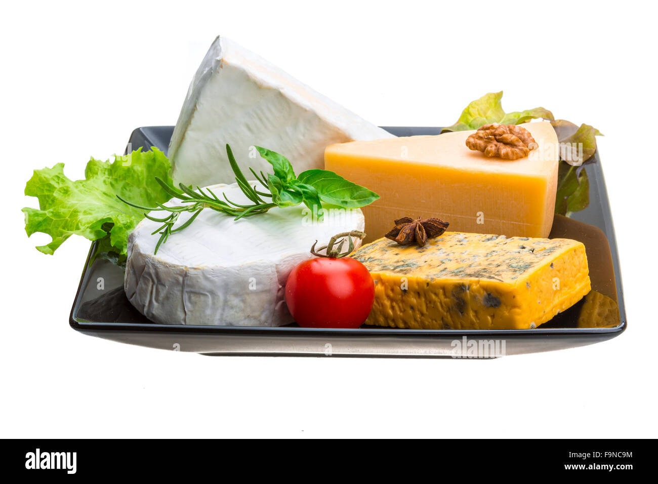 Variety cheese assortment with nuts and herbs Stock Photo - Alamy