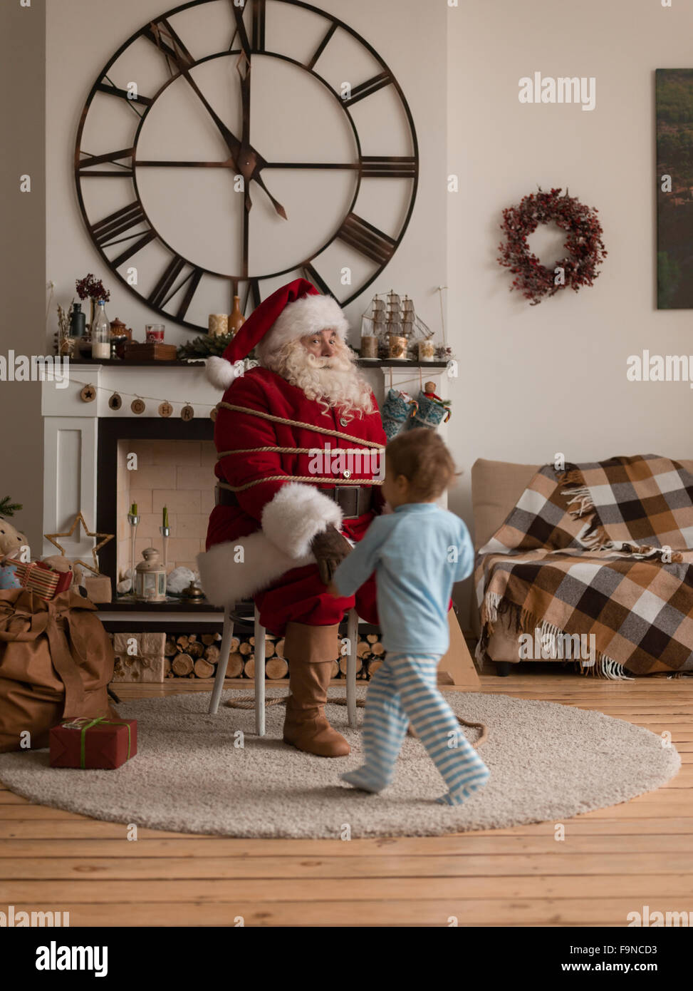 Santa Claus Playing at Home with Child Stock Photo - Alamy
