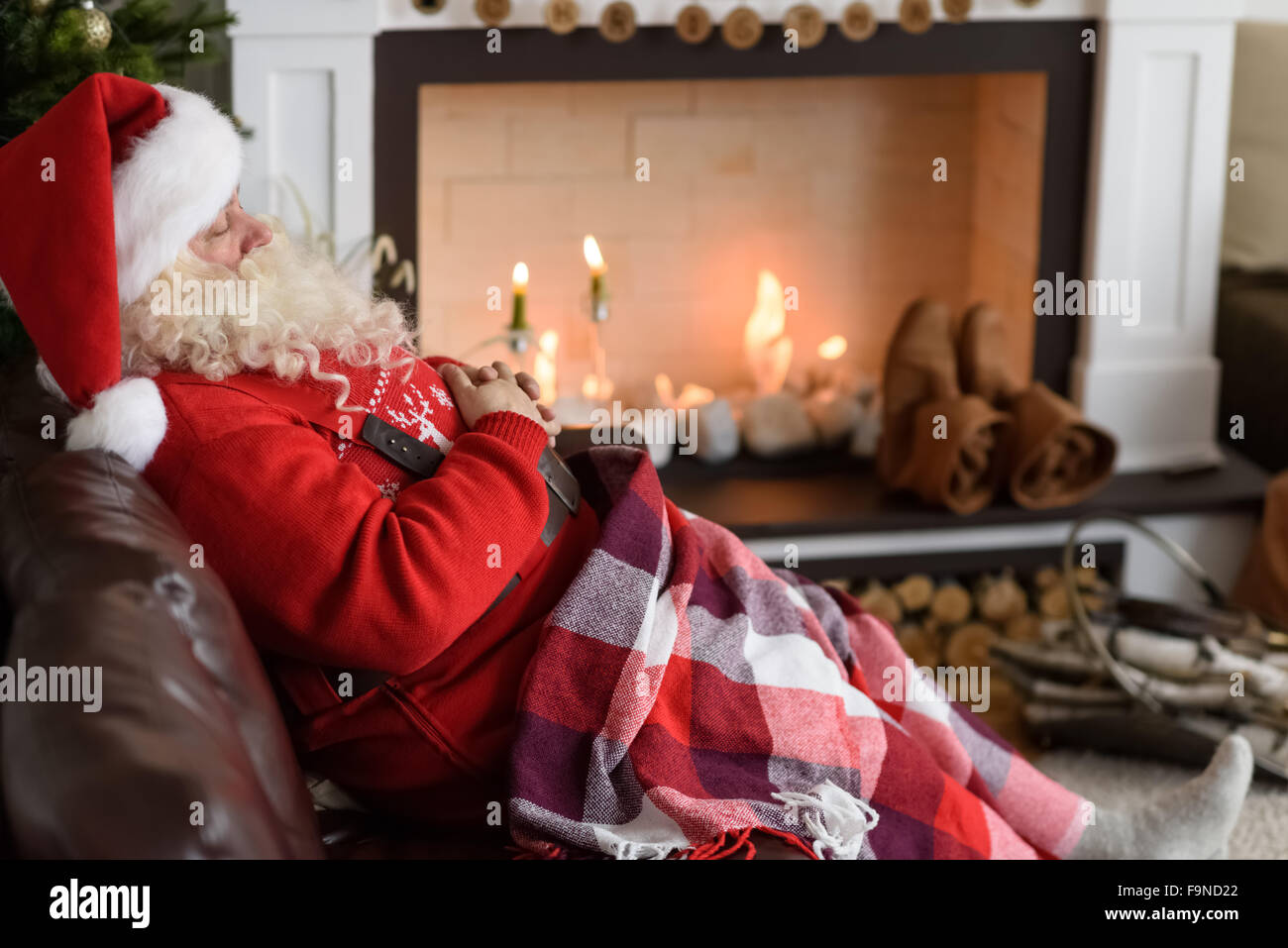 Santa Claus Warming near Fireplace at Home Stock Photo - Alamy