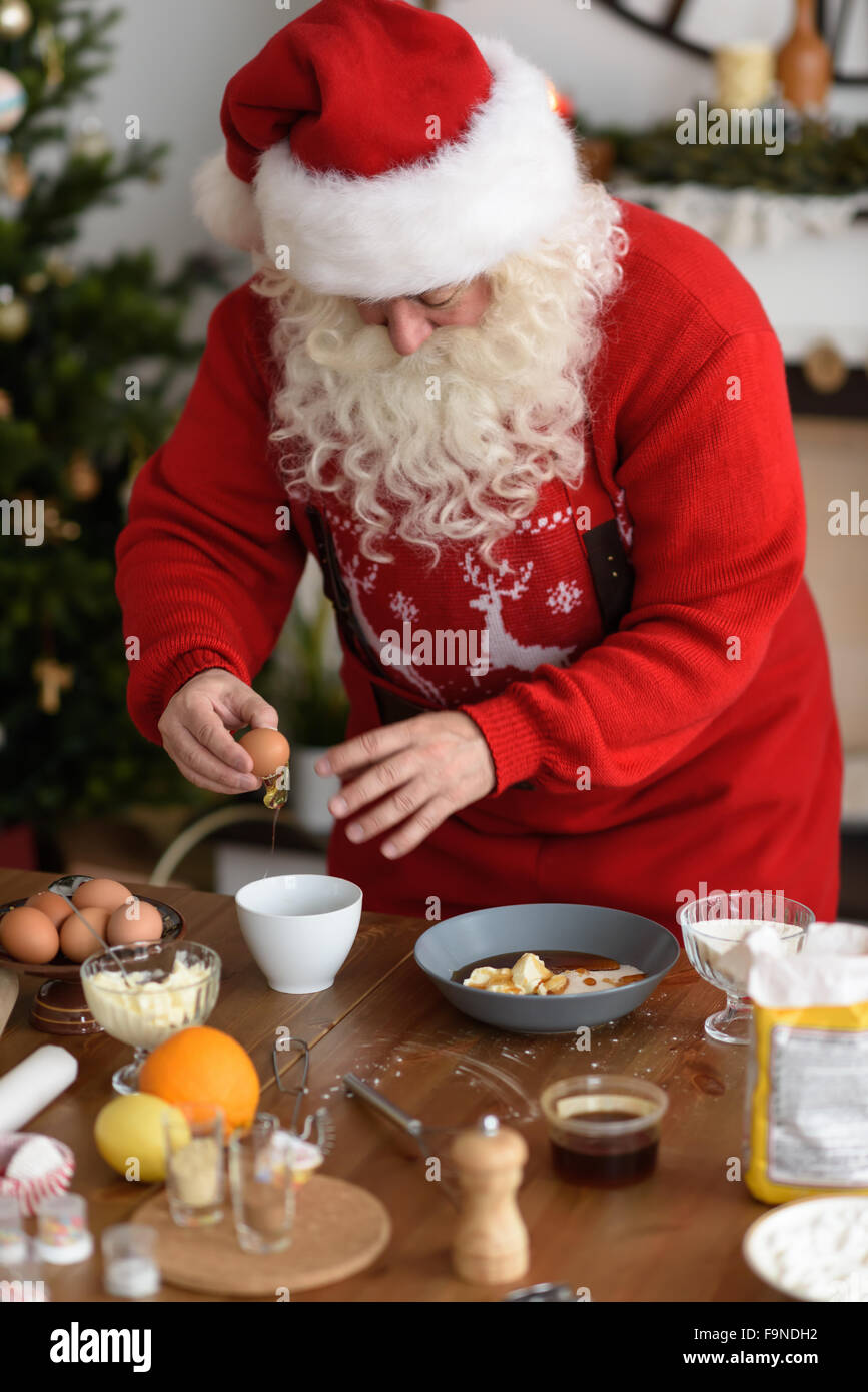 Santa Claus Cooking at Home Christmas Cookies Stock Photo - Alamy