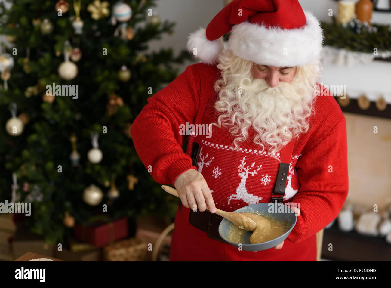 Santa Claus Cooking at Home Christmas Cookies Stock Photo - Alamy