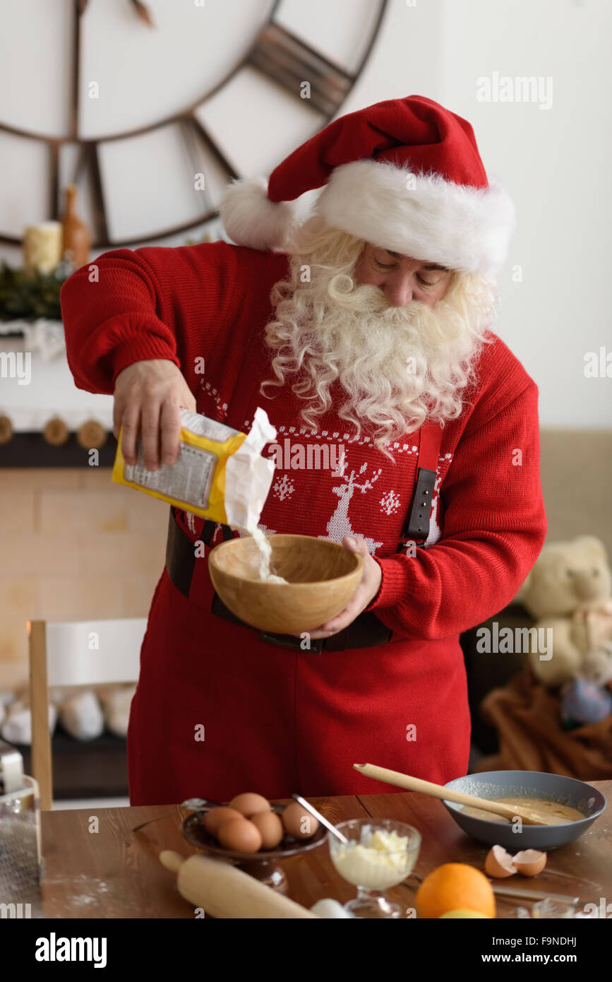 Santa Claus Cooking at Home Christmas Cookies Stock Photo - Alamy