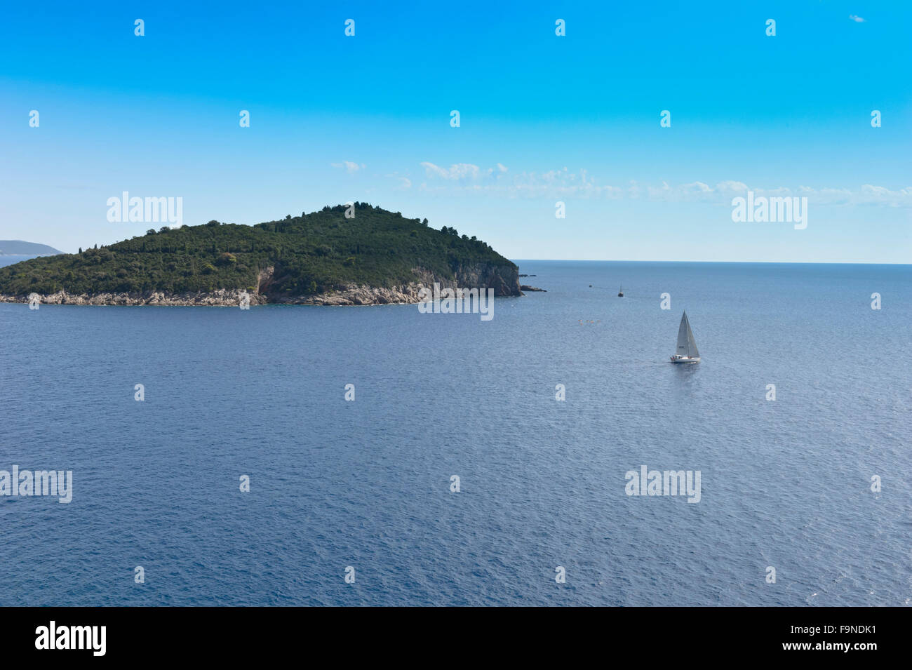 View of Lokrum Island and small boats from the city walls in Dubrovnik ...