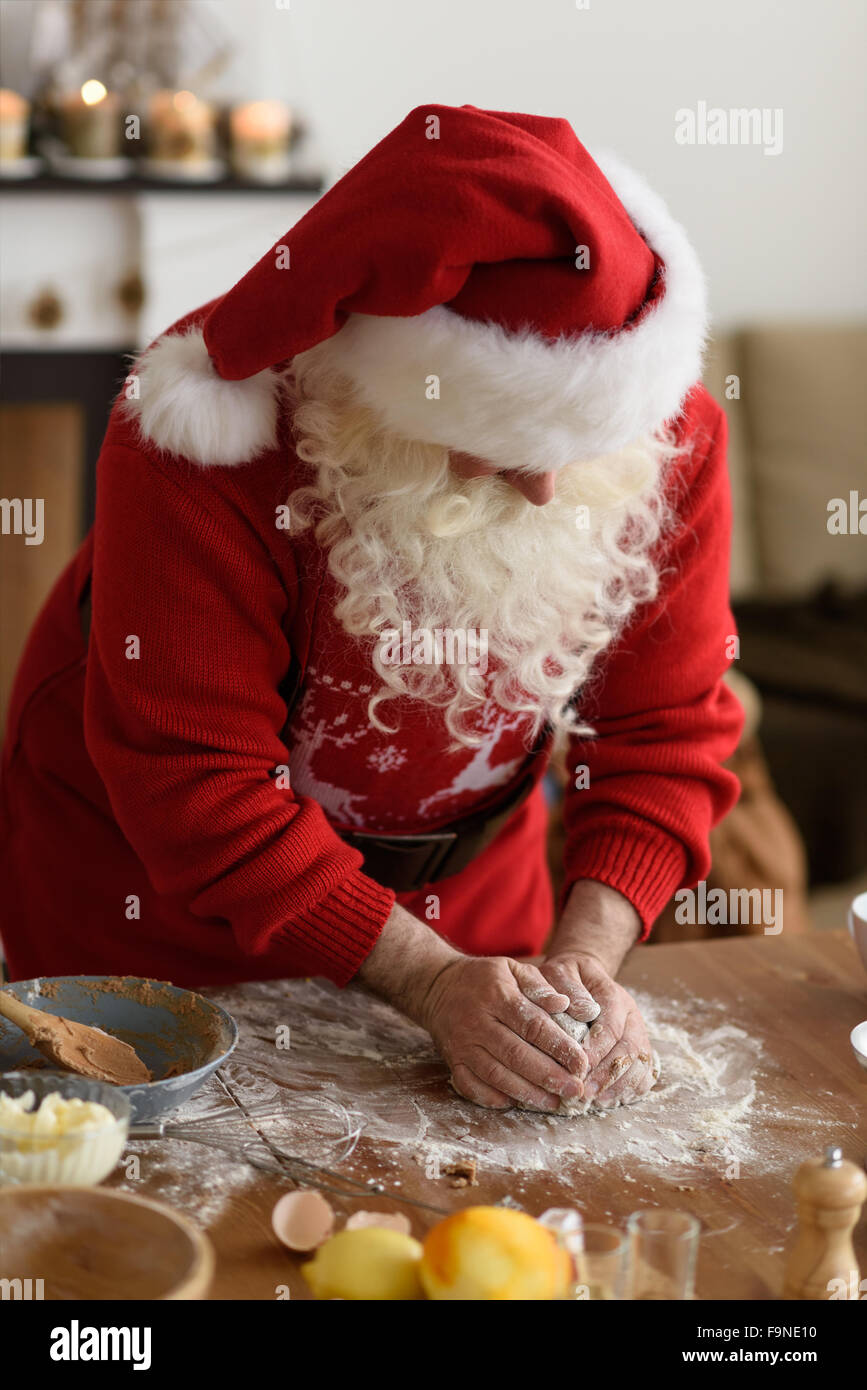 Santa Claus Cooking at Home Christmas Cookies Stock Photo - Alamy