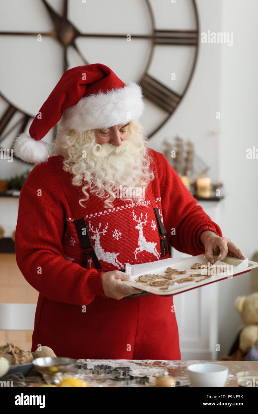 Santa Claus Cooking at Home Christmas Cookies Stock Photo - Alamy