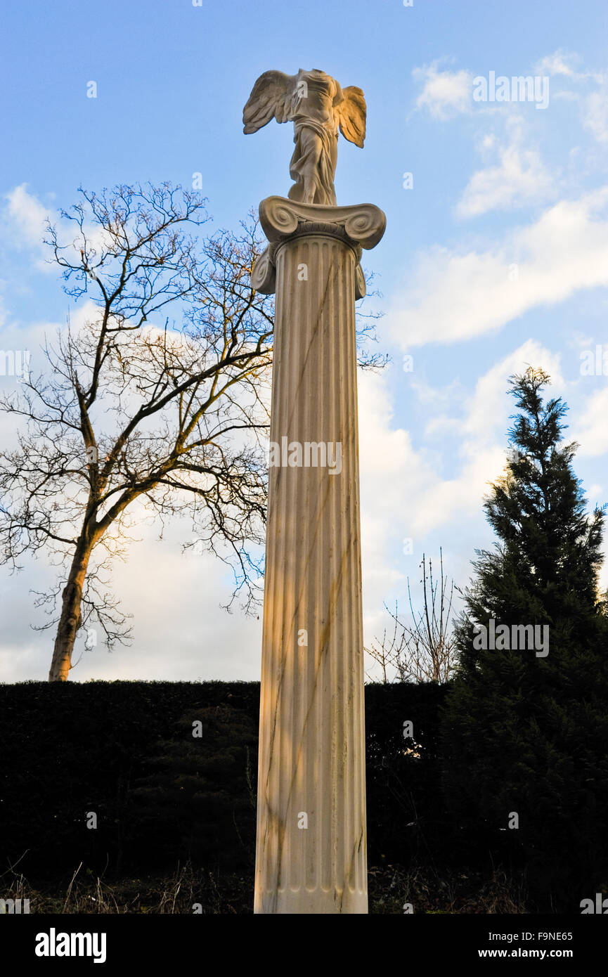 Roman column with winged figure Stock Photo - Alamy