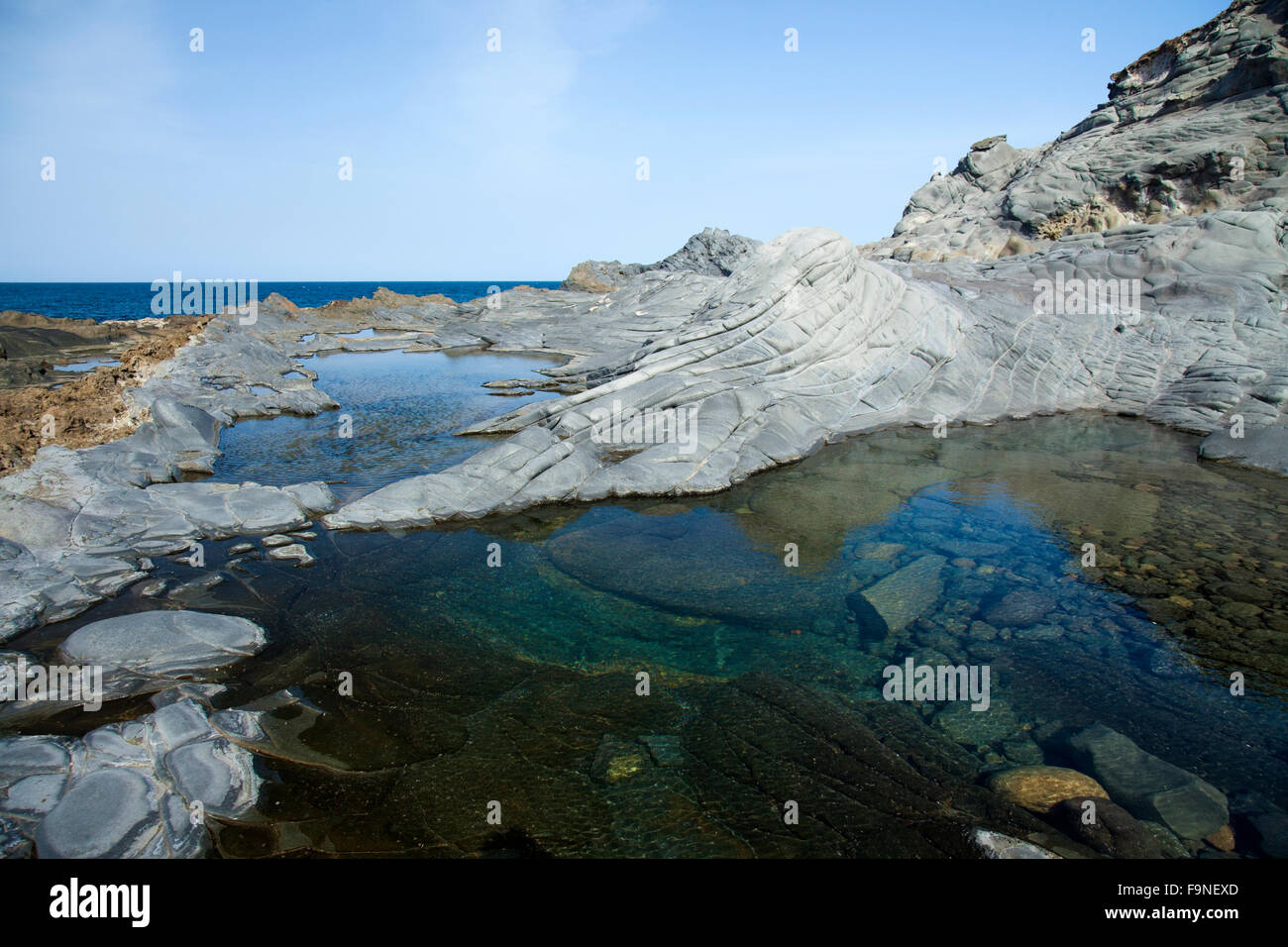 Gran Canaria, Banaderos area, calm rock pools, ocean at low tide Stock ...