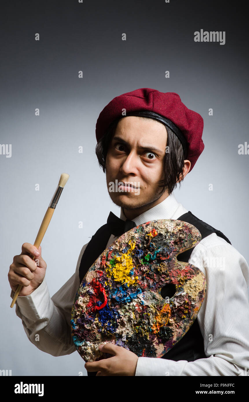 Funny artist in dark studio Stock Photo - Alamy