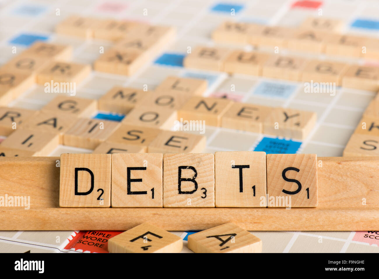 Scrabble - DEBTS Stock Photo - Alamy