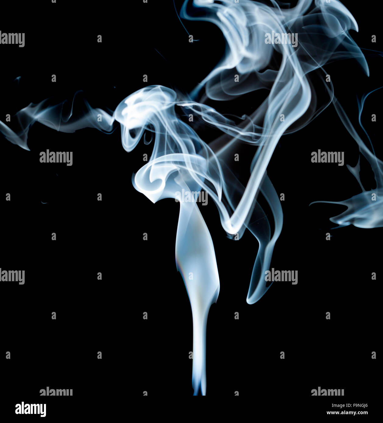 wisp of smoke on black background Stock Photo - Alamy