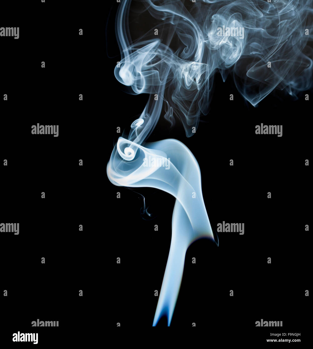 wisp of smoke on black background Stock Photo - Alamy