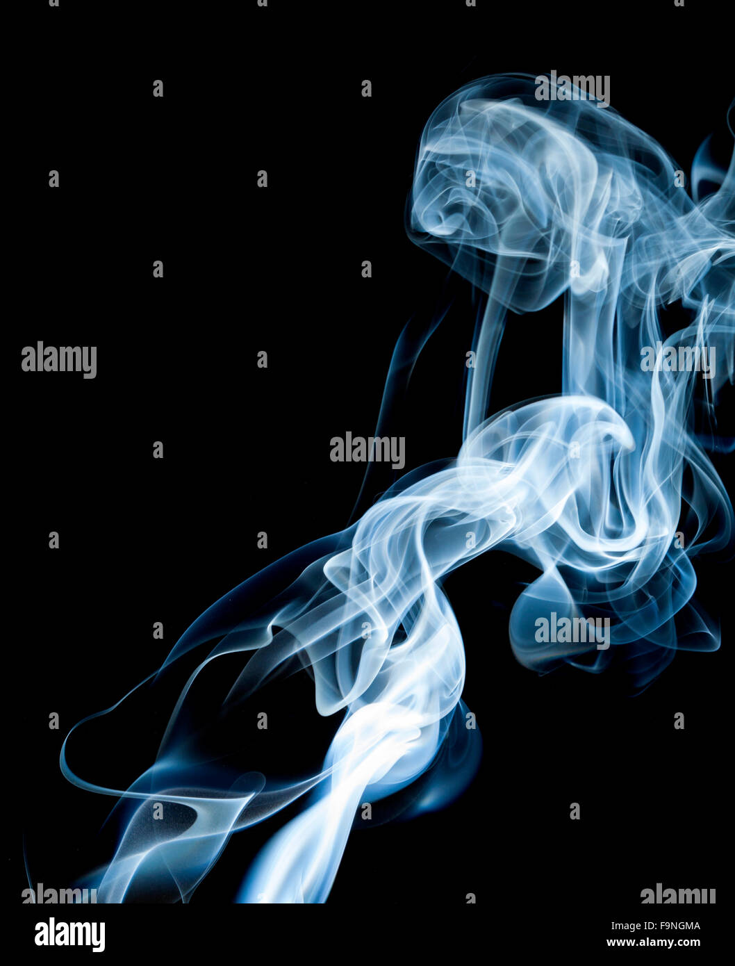 wisp of smoke on black background Stock Photo - Alamy