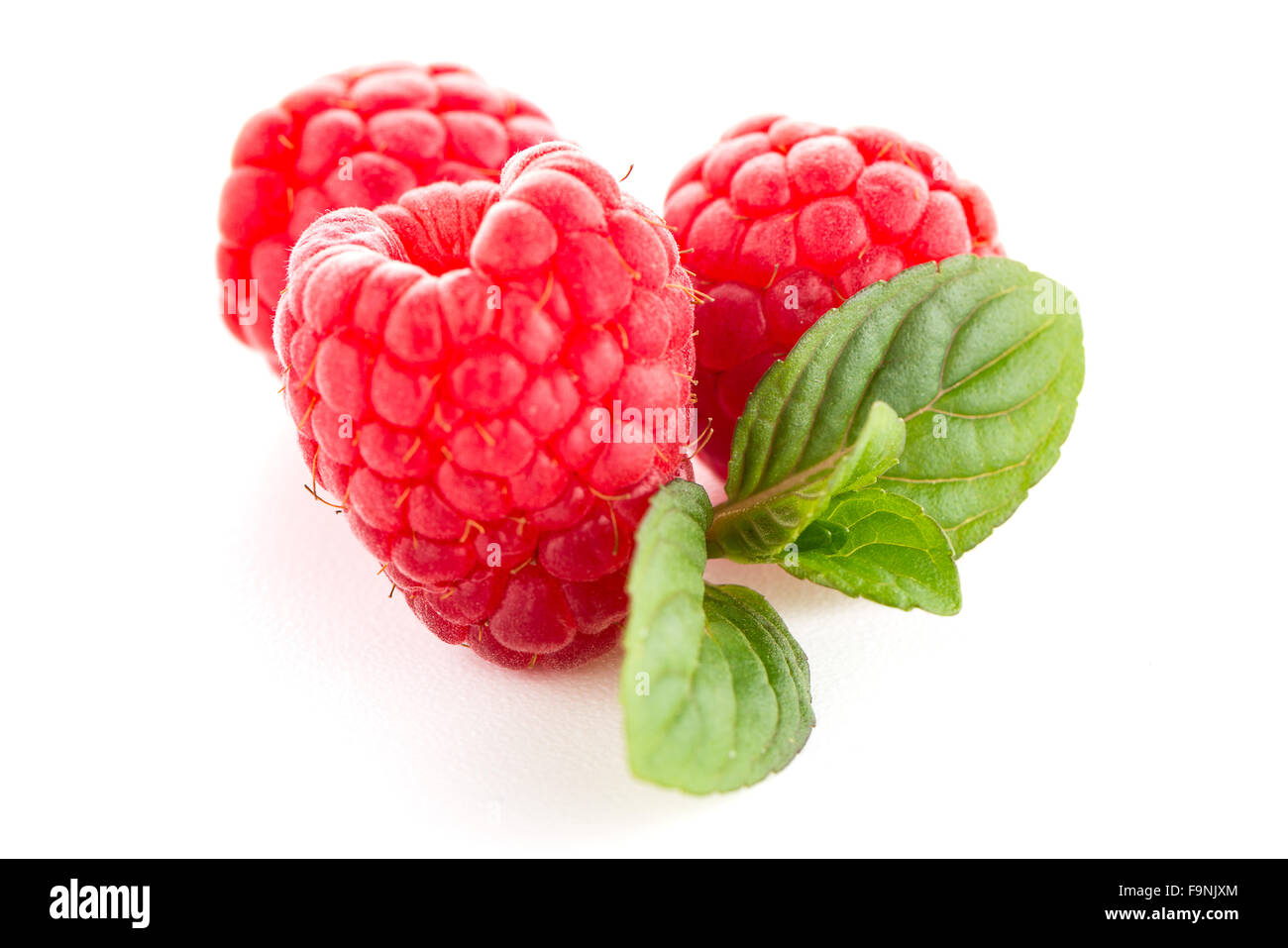 Raspberries with leaves isolated on white background Stock Photo - Alamy