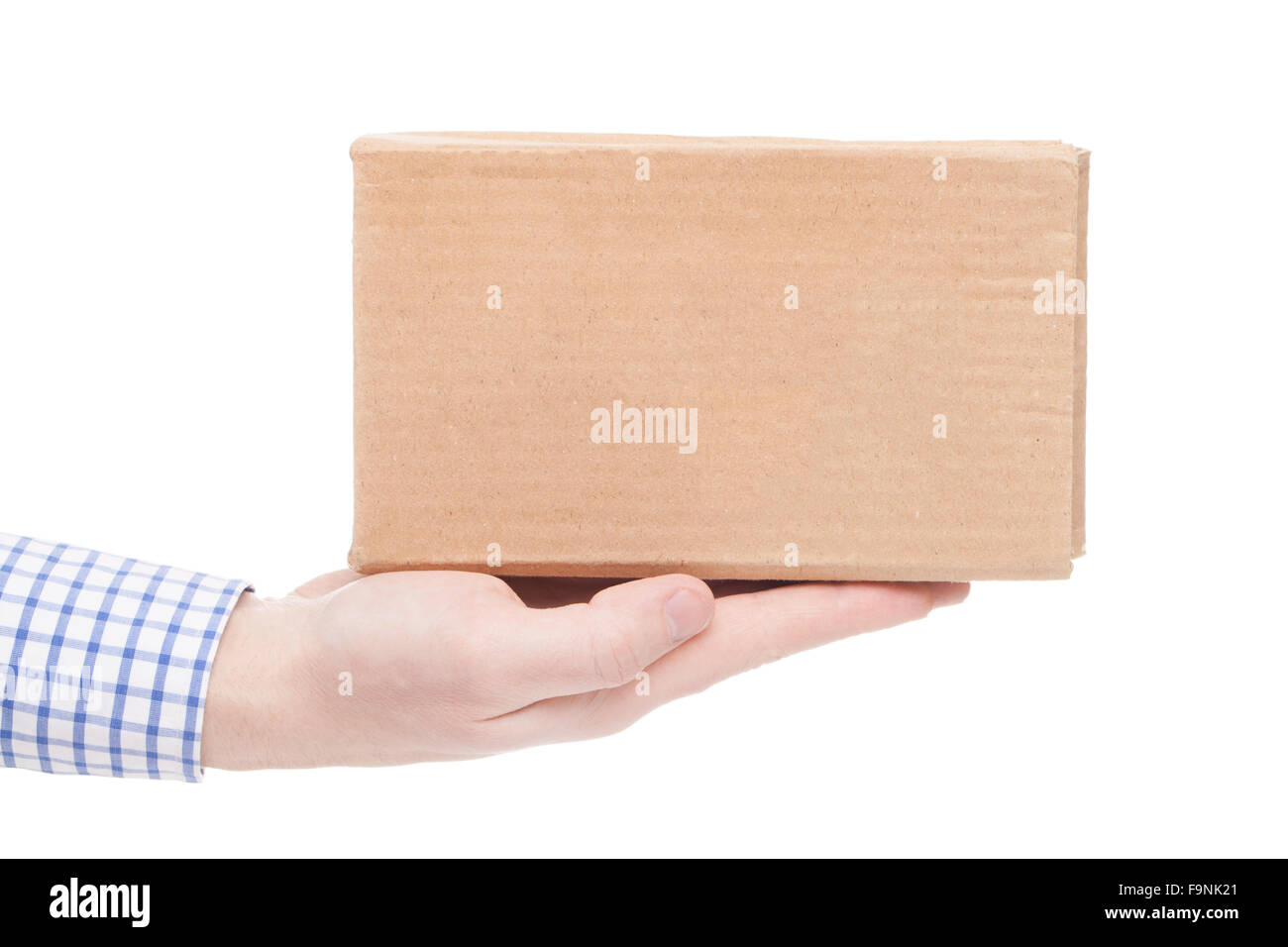 Delivering of parcel to the customer (only one hand and parcel seen ...