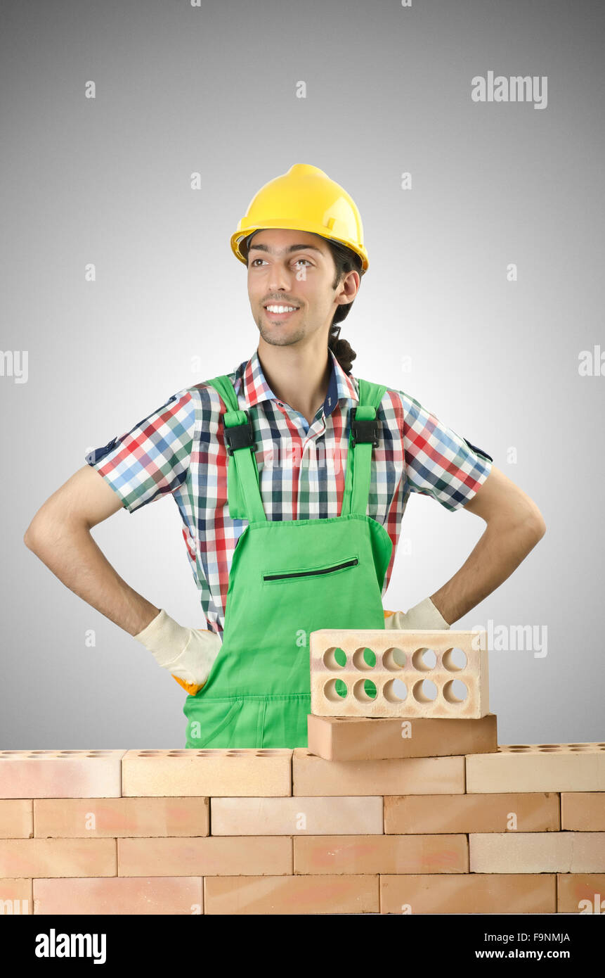 Builder with hard hat on white Stock Photo - Alamy