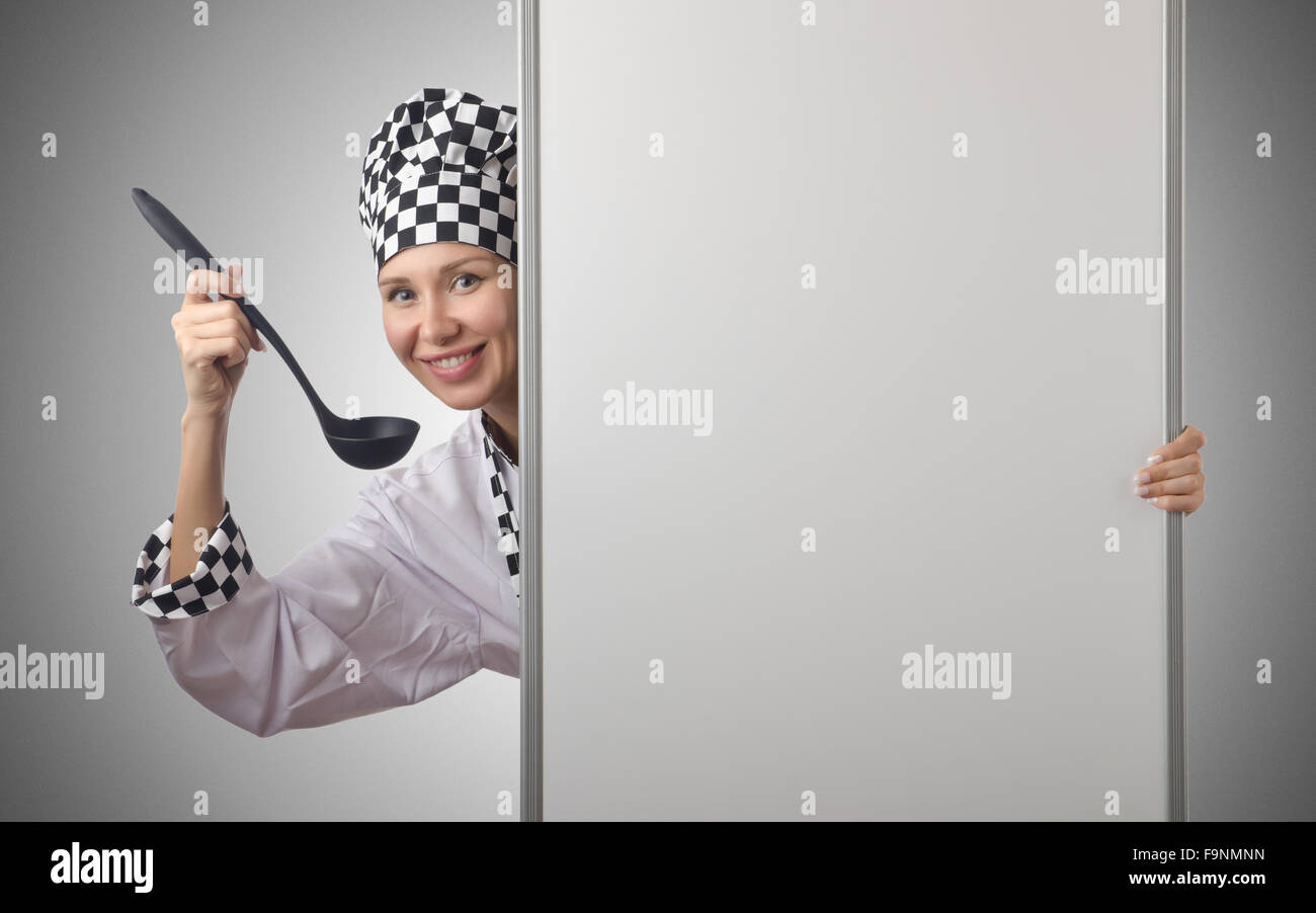 Cook with ladle and blank board Stock Photo - Alamy