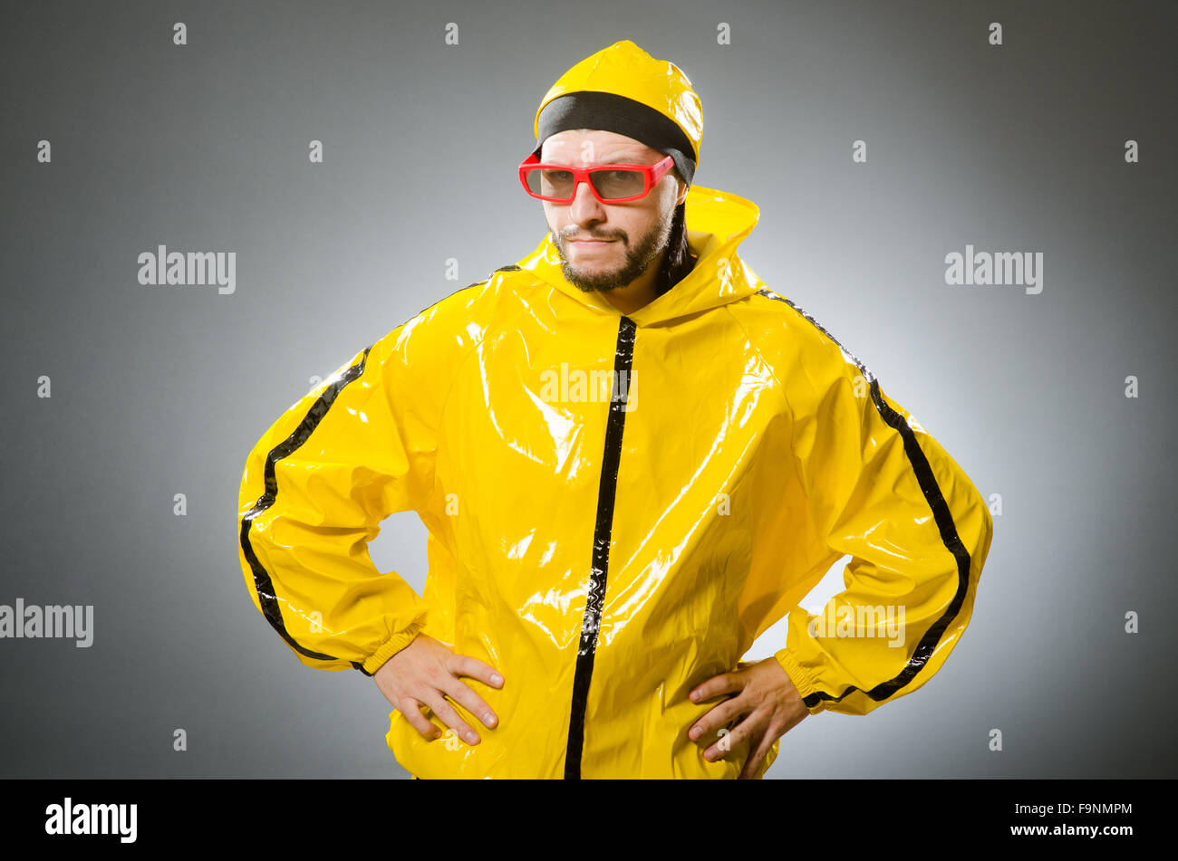 Funny man wearing yellow suit Stock Photo - Alamy