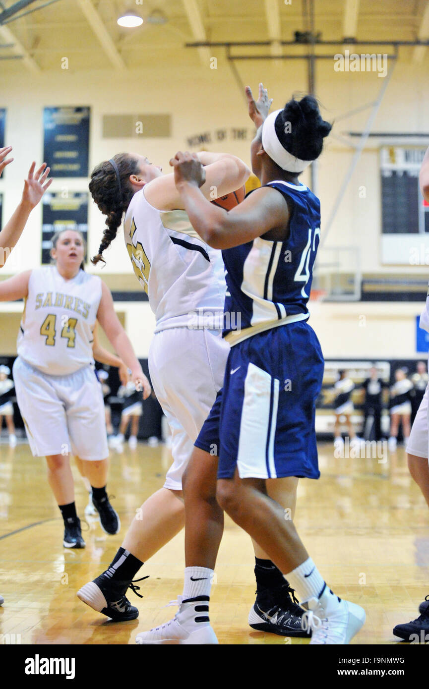 Player secures a a loose ball in front of the an opponent in the lane ...