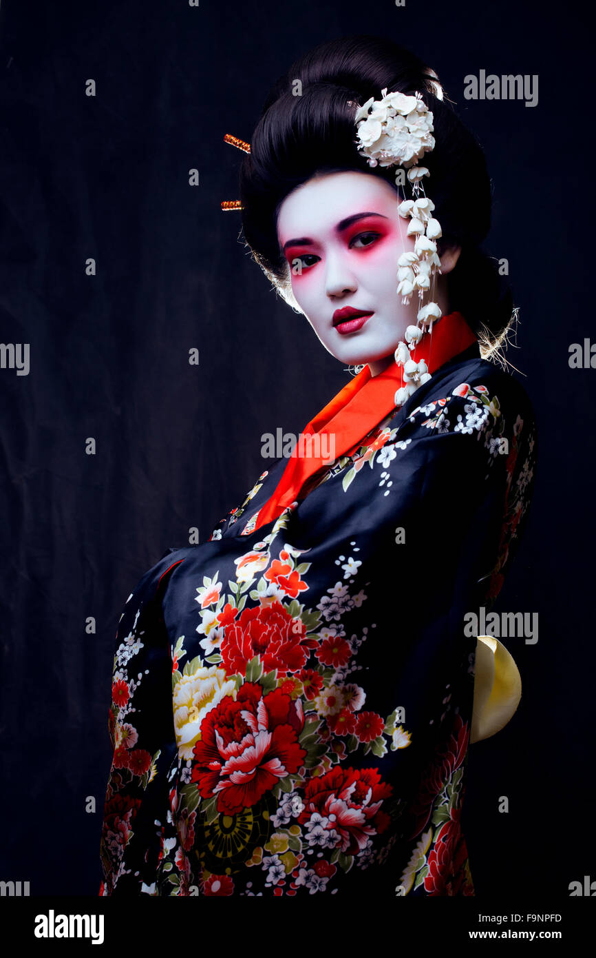 young pretty geisha in kimono with sakura and decoration Stock Photo ...